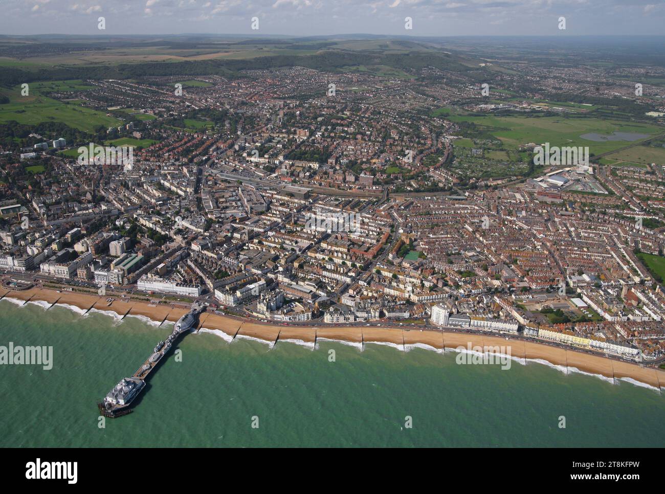 Aerial view of the coastal town of Eastbourne nestled along the shores ...
