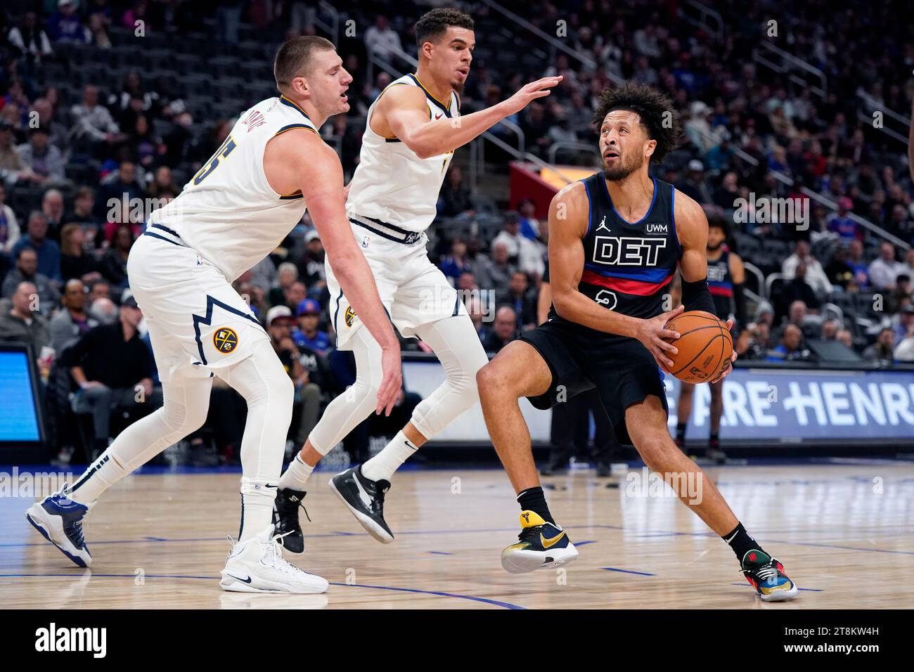 Detroit Pistons guard Cade Cunningham (2) is defended by Denver Nuggets ...