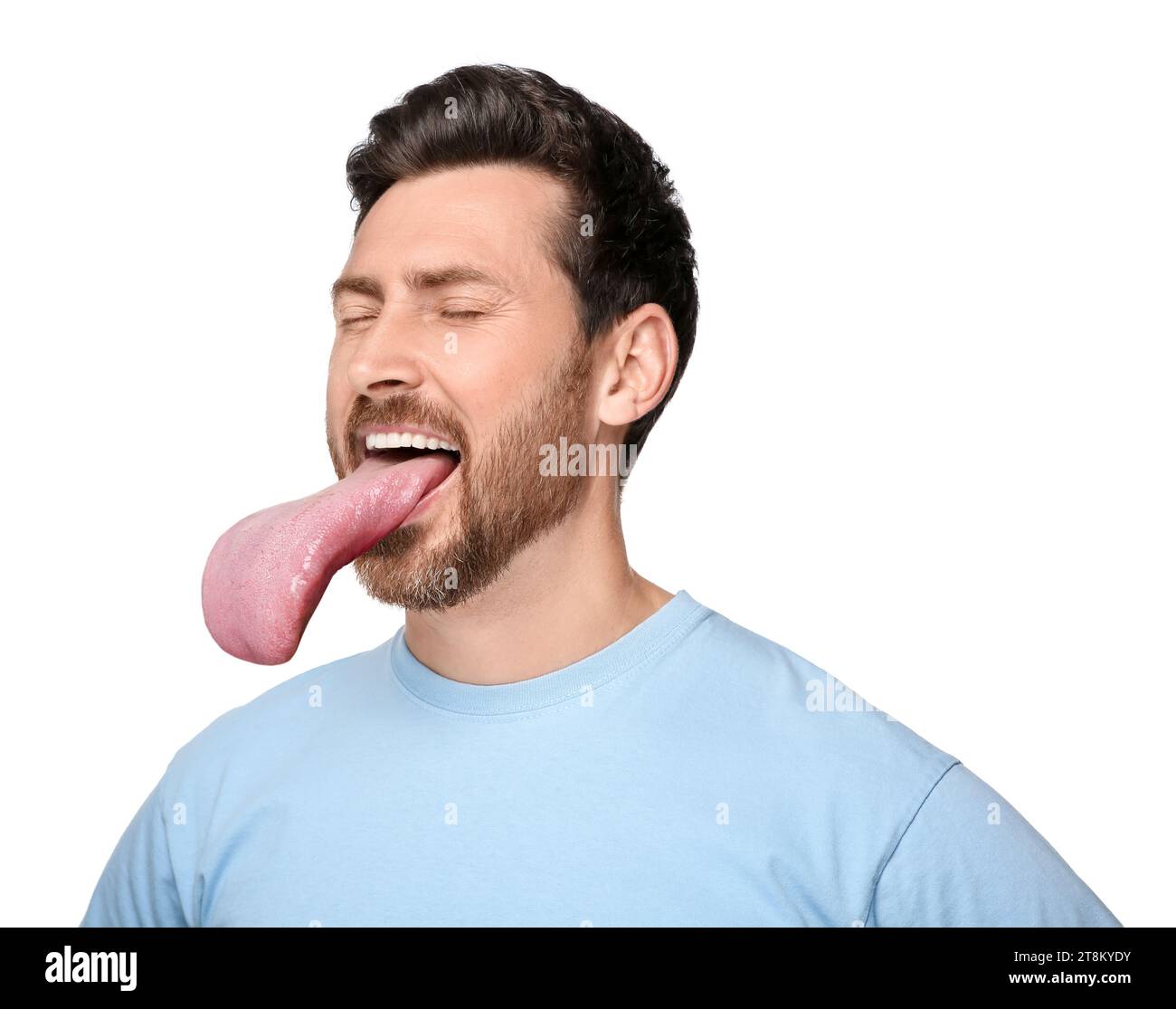 Portrait of handsome man showing long tongue on white background Stock ...