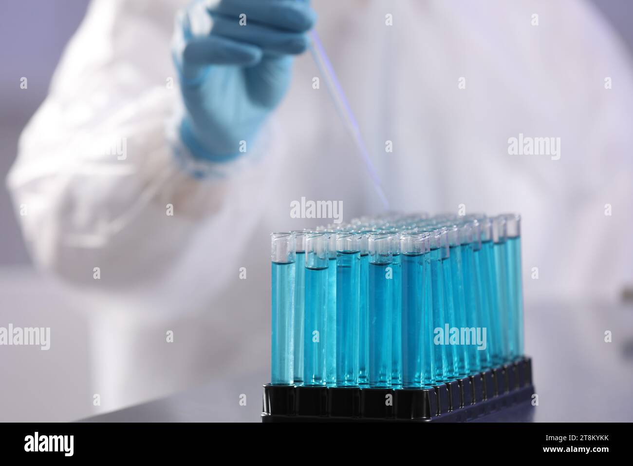 Scientist taking sample blue liquid hi-res stock photography and images ...