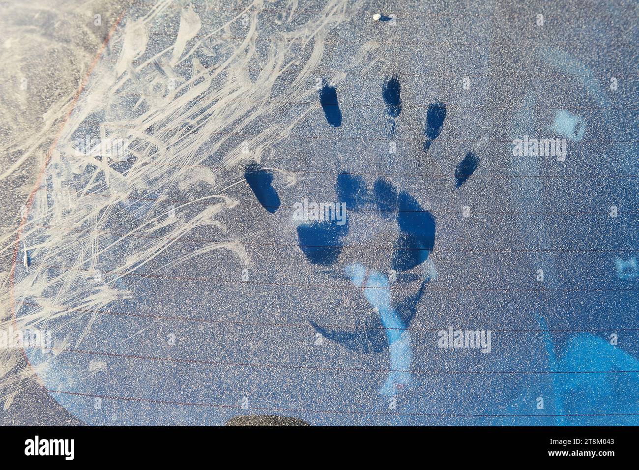 Hand shapes on dirty glass car window Stock Photo - Alamy