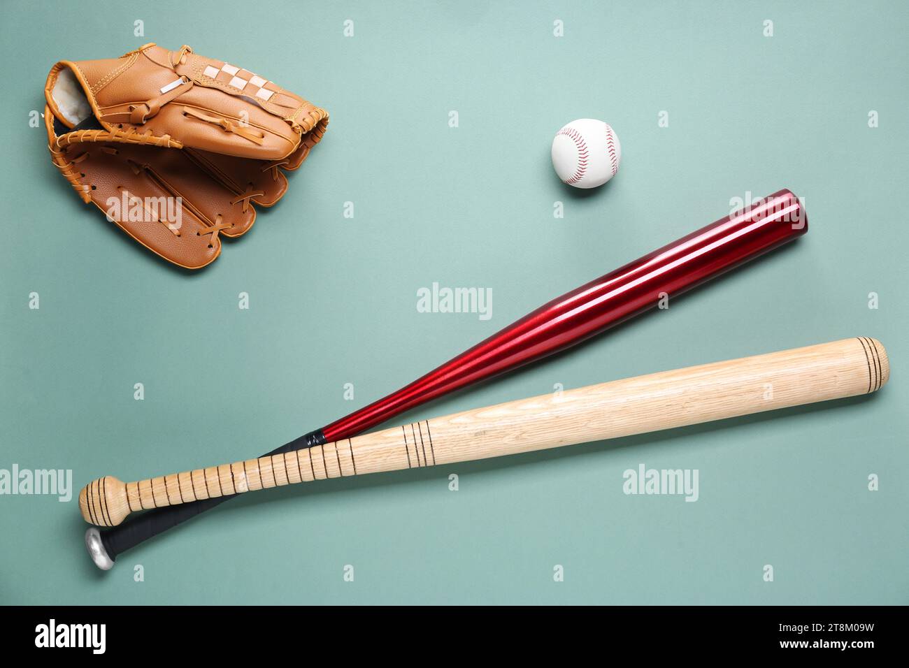 Baseball glove, bats and ball on pale green background, flat lay Stock ...