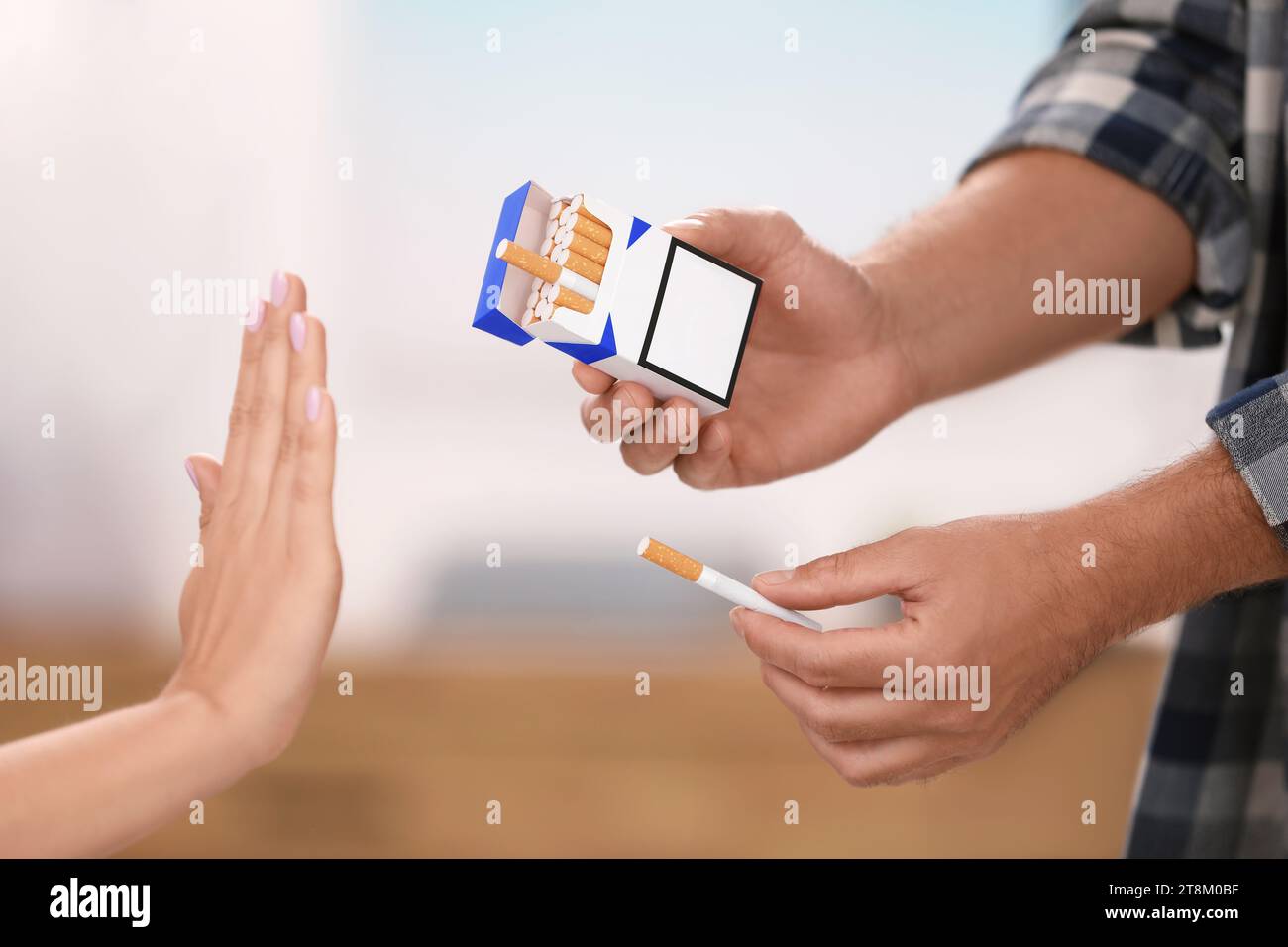 Stop smoking concept. Woman refusing cigarettes on blurred background ...