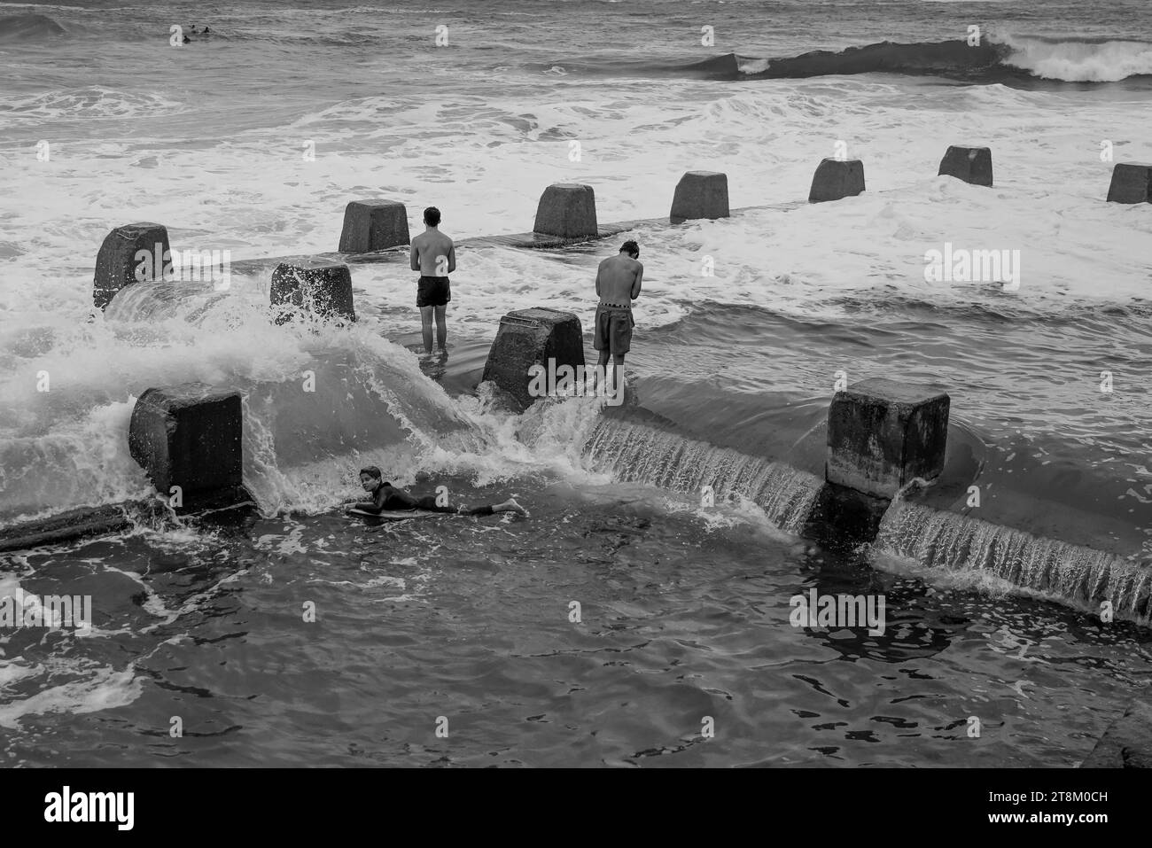 Swimmers prepare to jump into the Coogee ocean pool amidst big waves ...