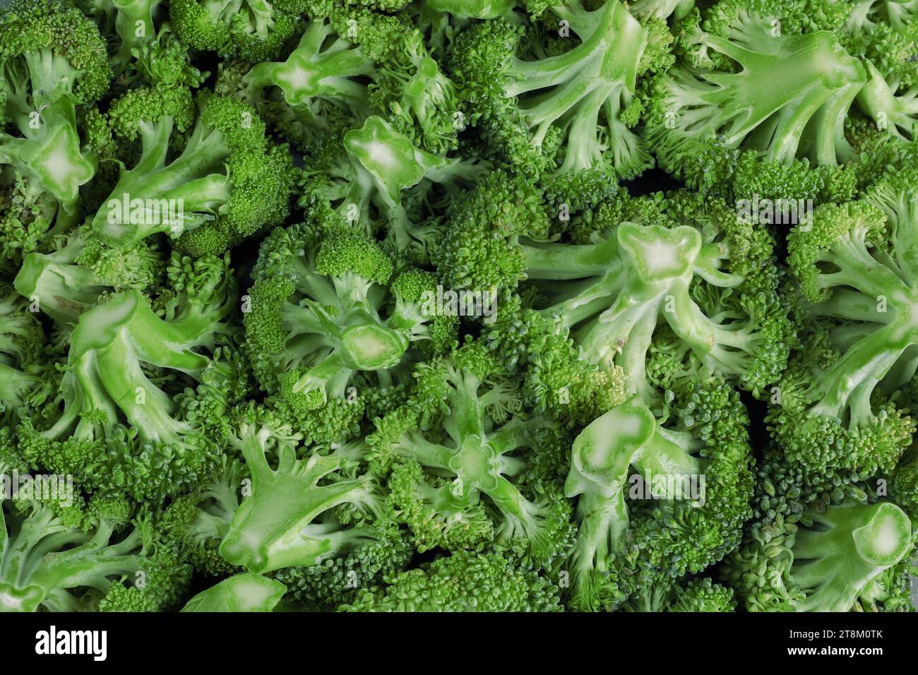 Fresh raw broccoli as background, top view Stock Photo - Alamy