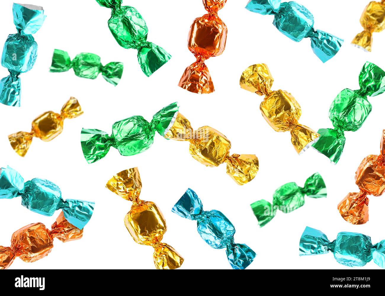 Tasty candies in bright wrappers falling on white background Stock ...