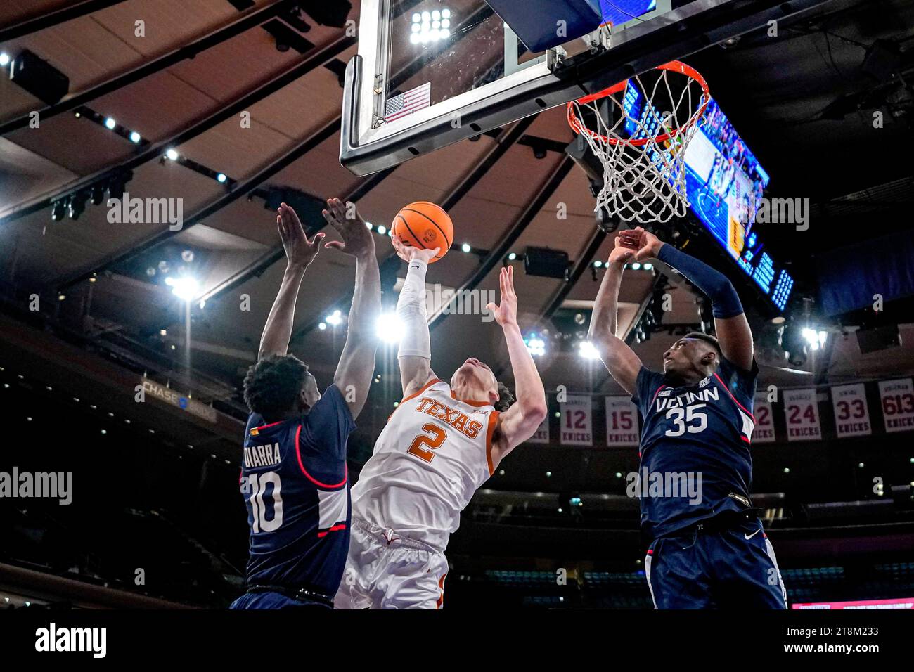 Texas guard Chendall Weaver (2) shoots over UConn guard Hassan Diarra ...