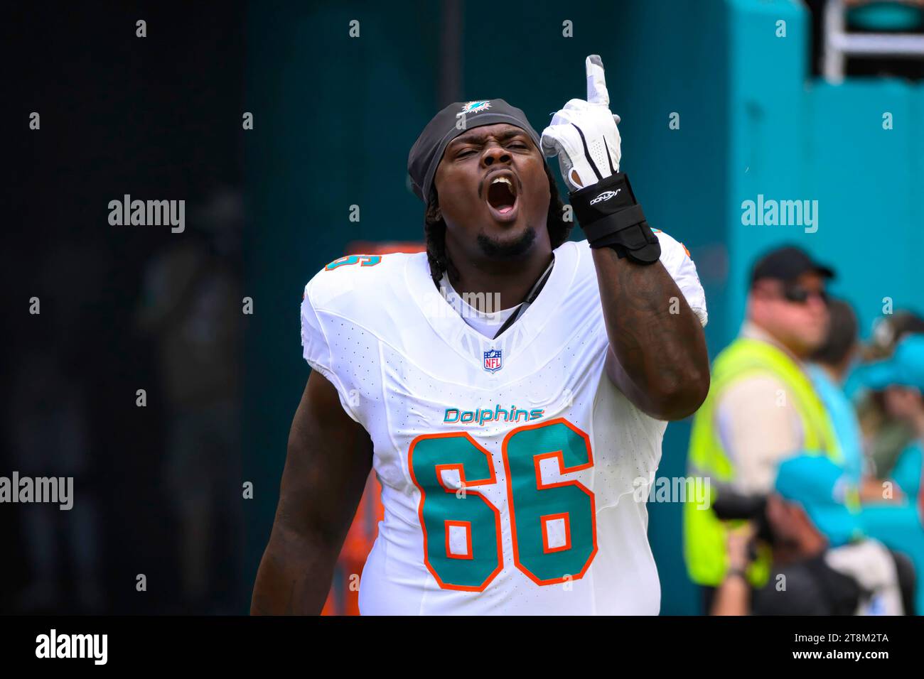 Miami Dolphins offensive lineman Lester Cotton (66) reacts as he runs ...