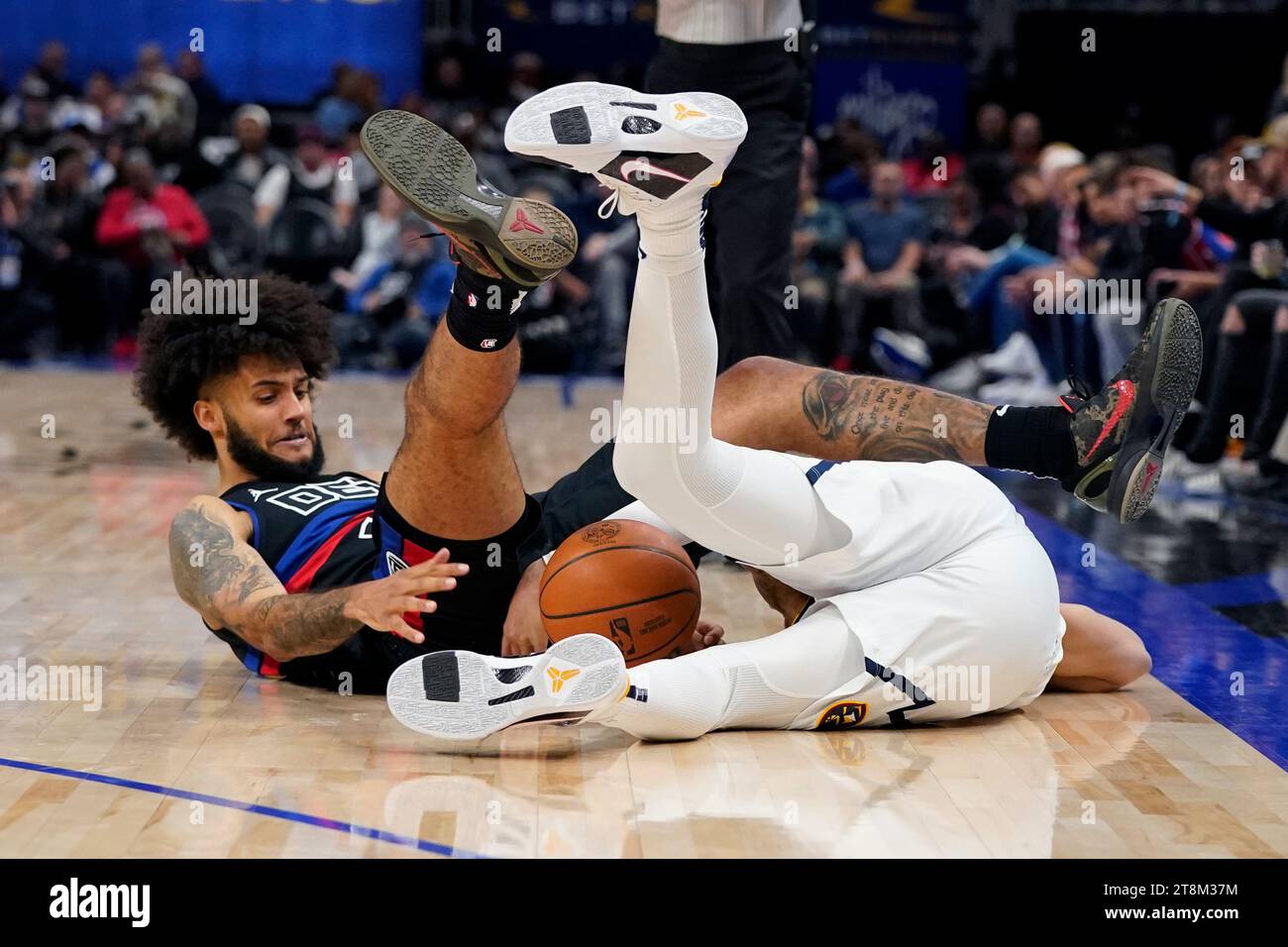 Detroit Pistons forward Isaiah Livers and Denver Nuggets guard Julian ...