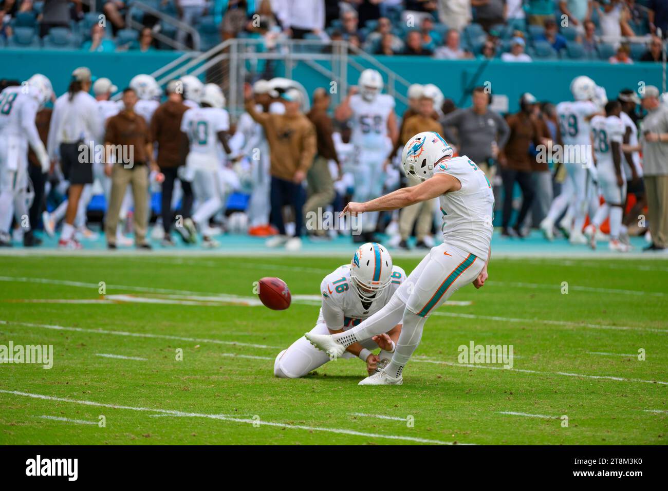 Miami Dolphins punter Jake Bailey (16) holds the ball as Miami Dolphins ...