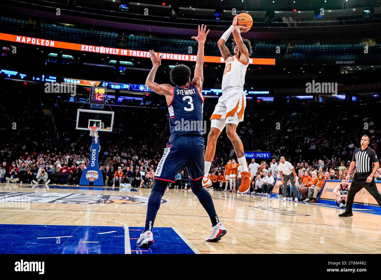 Texas forward Dillon Mitchell (23) shoots the ball over Connecticut ...