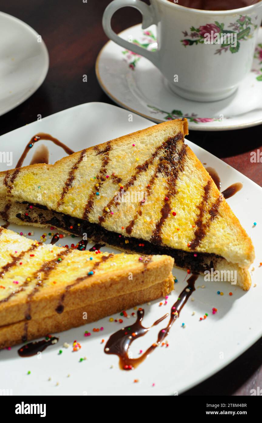chocolate toast served with a cup of tea Stock Photo - Alamy