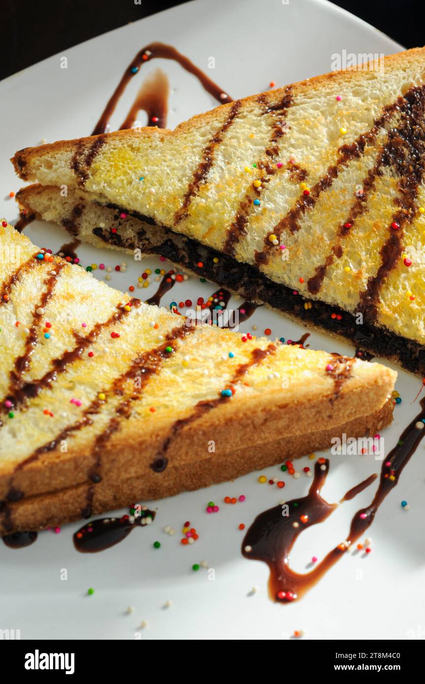 chocolate toast served with a cup of tea Stock Photo - Alamy