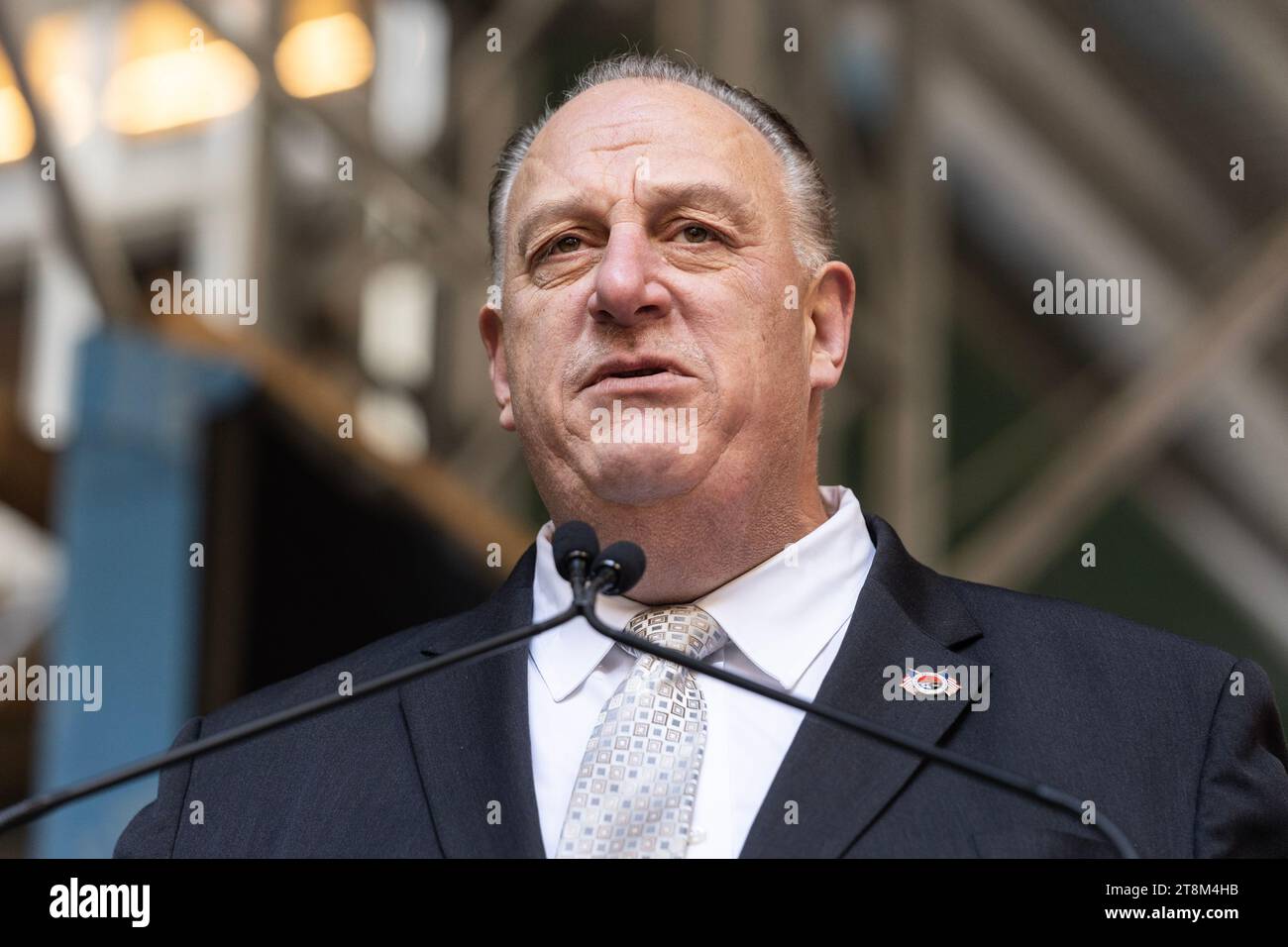 Gary LaBarbera speaks during ceremony for final steel beam wrapped with ...