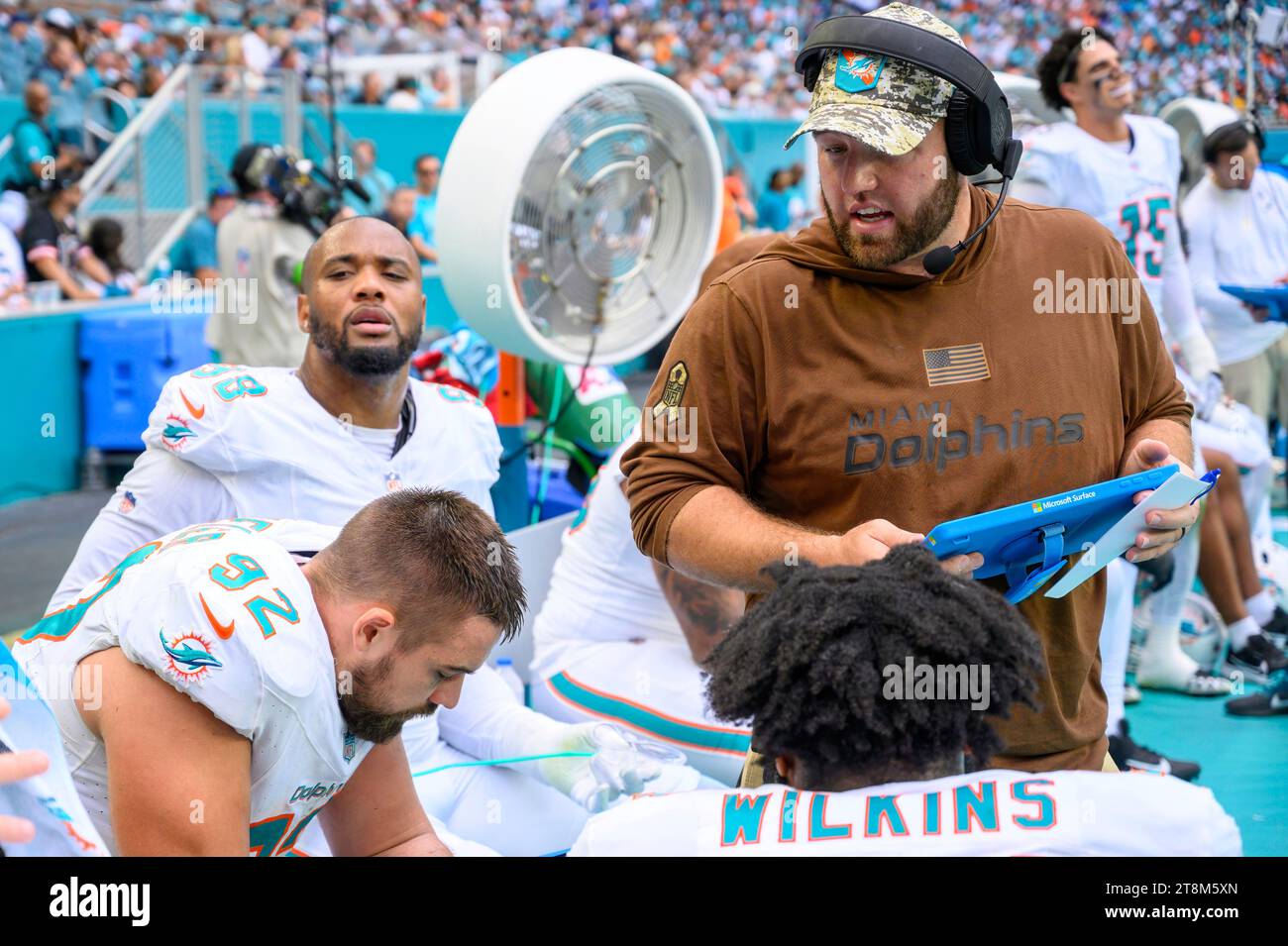 Miami Dolphins defensive line coach Austin Clark talks to defensive tackle Raekwon Davis (98 ...