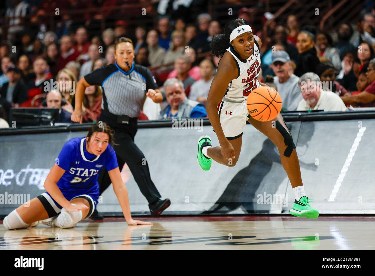 South Carolina guard Raven Johnson, right, pushes the ball upcourt ...