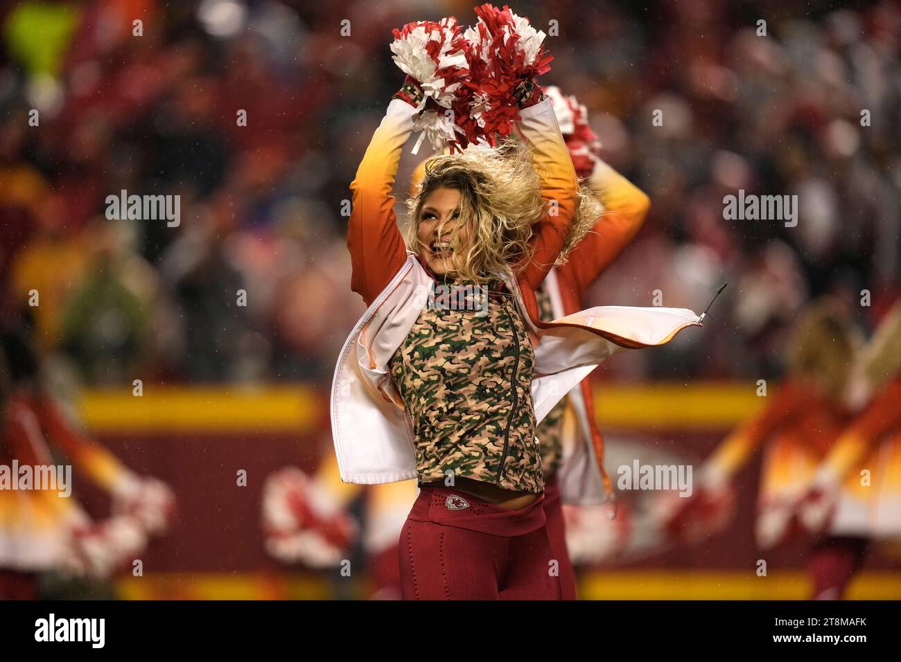 A cheerleader performs during the first half of an NFL football game ...