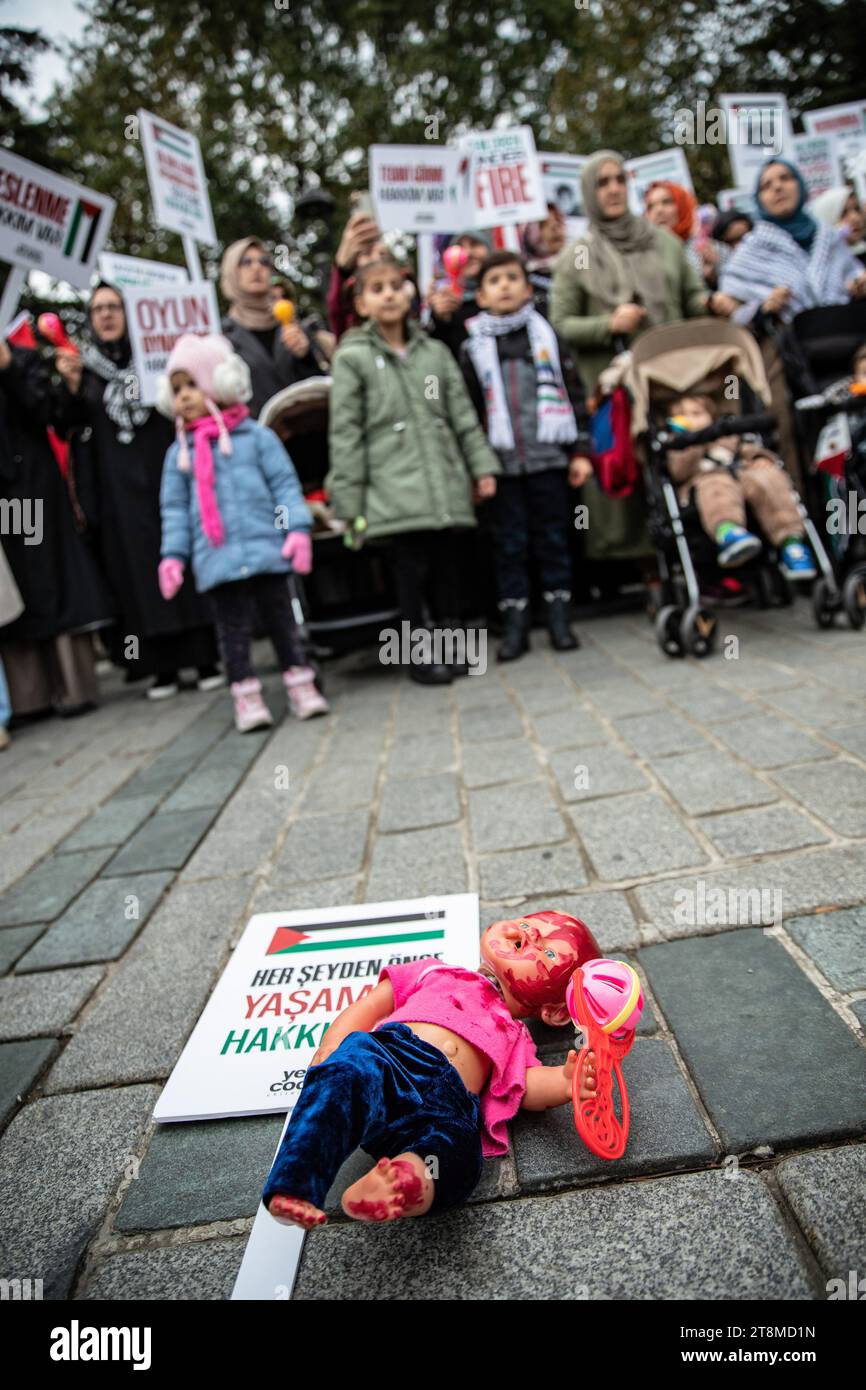 A doll covered with fake blood and a placard saying "Above all, I have ...