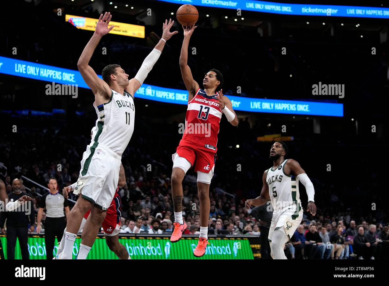 Washington Wizards guard Jordan Poole (13) shoots over Milwaukee Bucks ...
