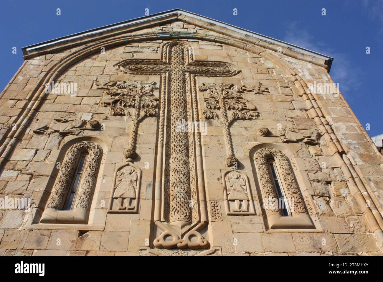 Large cross on the side of the church at the Ananuri Fortress Complex ...