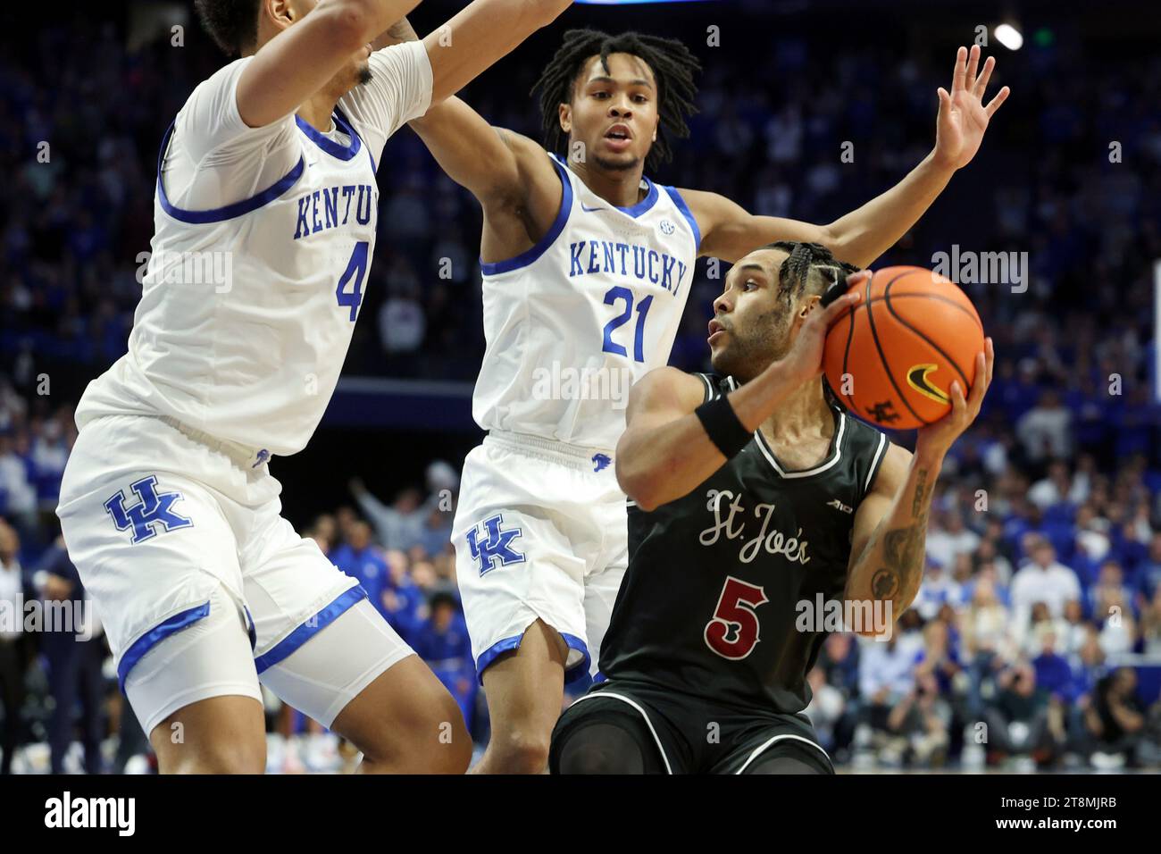 Saint Joseph's Lynn Greer III, right, looks for an opening against ...