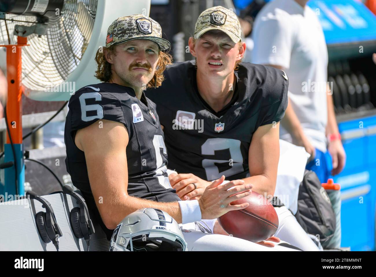 Las Vegas Raiders punter AJ Cole (6) and kicker Daniel Carlson (2) sit ...