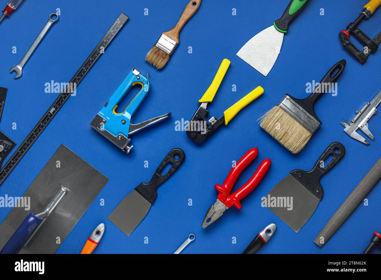 Set of construction tools on blue background Stock Photo - Alamy