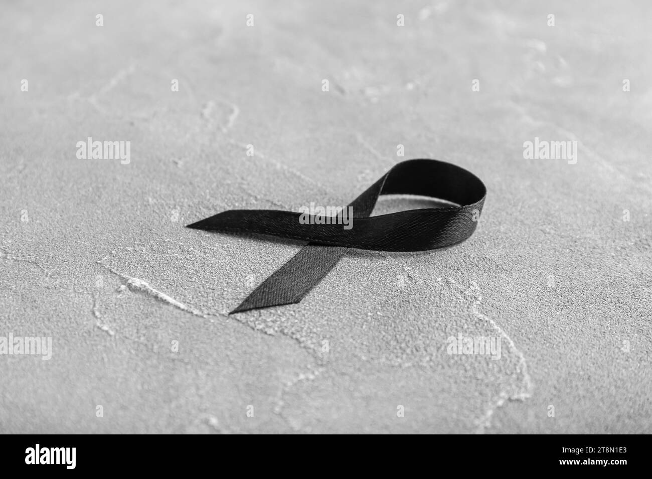 Black funeral ribbon on grey background Stock Photo - Alamy