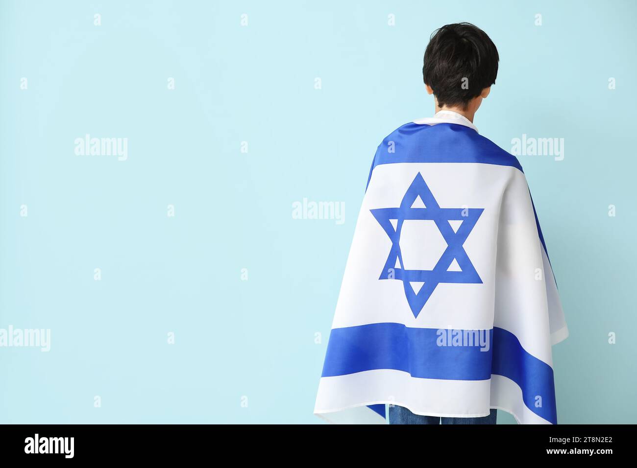 Little boy with Israel flag on blue background, back view Stock Photo ...