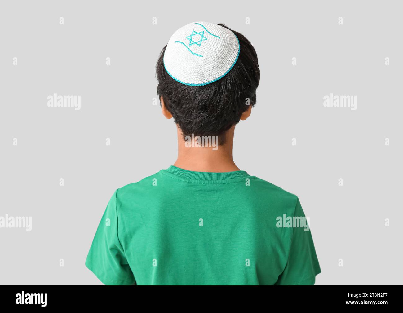Little Israeli boy in kipa on grey background, back view Stock Photo ...