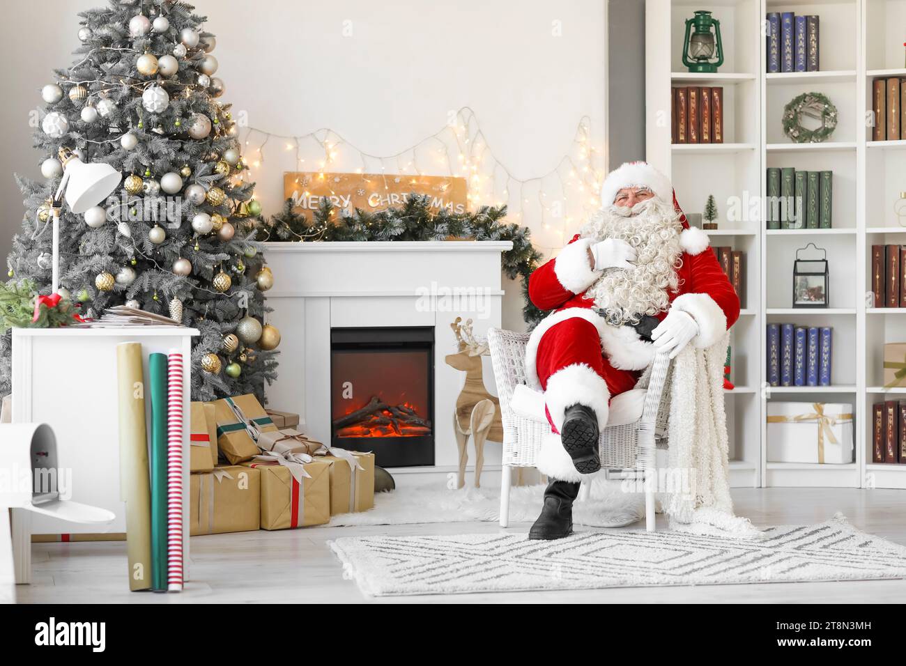 Santa Claus at home on Christmas eve Stock Photo - Alamy