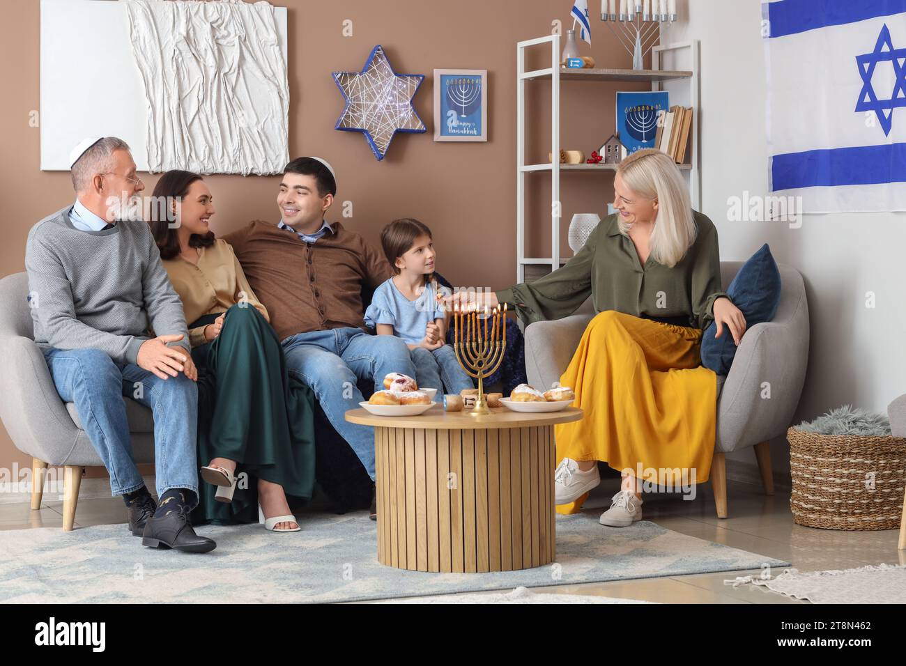Happy Jewish family celebrating Hanukkah at home Stock Photo - Alamy