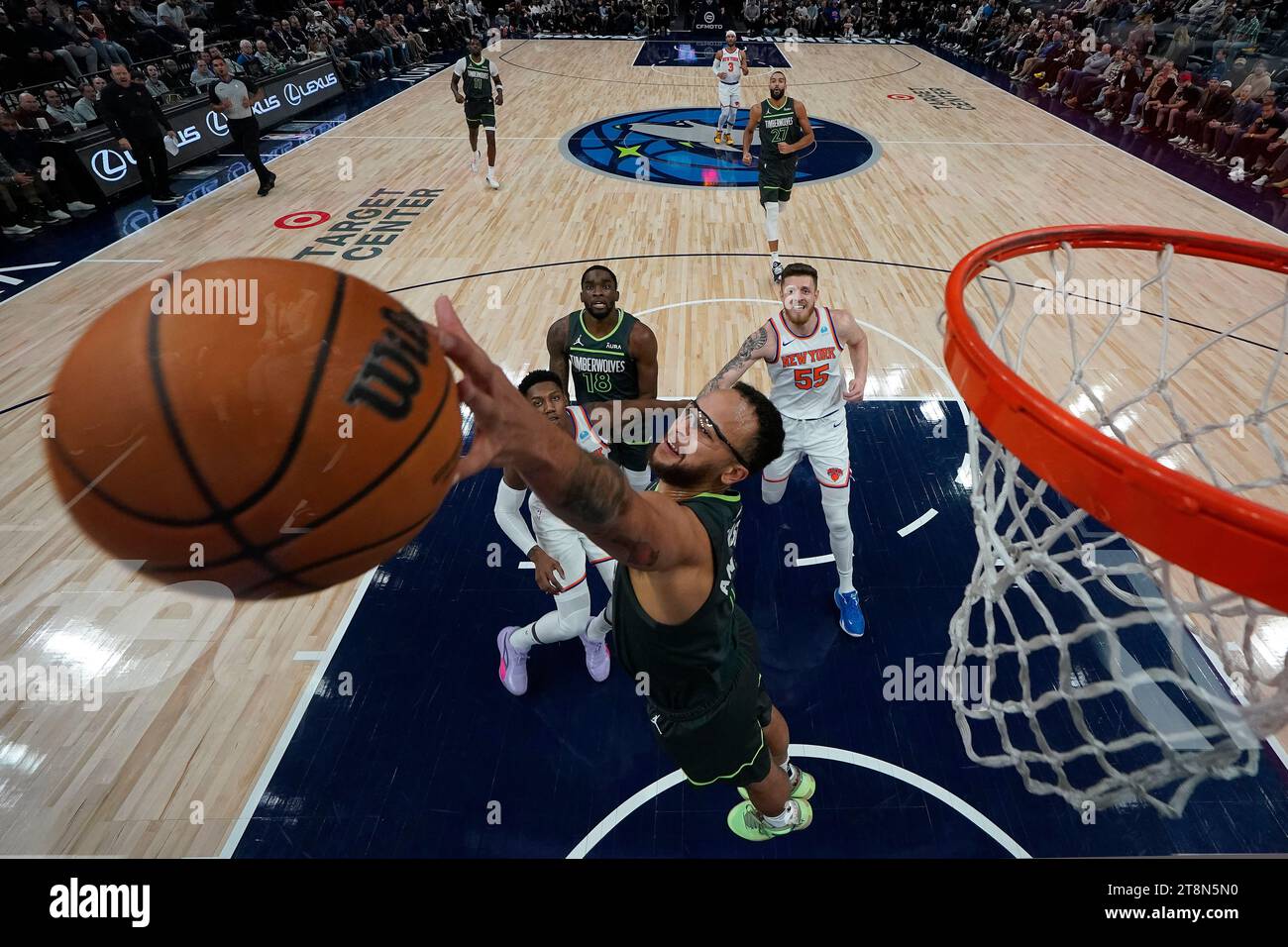 Minnesota Timberwolves forward Kyle Anderson, front, blocks a shot ...