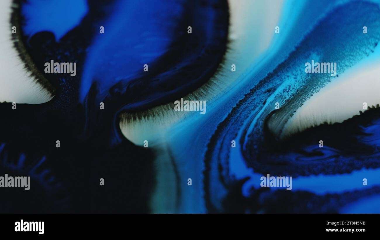 Paint flow ink blend wave blue black fluid mix Stock Photo - Alamy