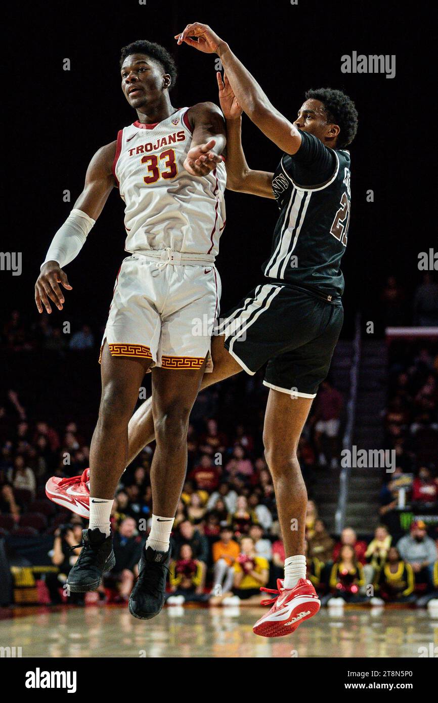 Brown Bears guard Aaron Cooley (21) shoots over USC Trojans forward Kijani Wright (33) during a ...