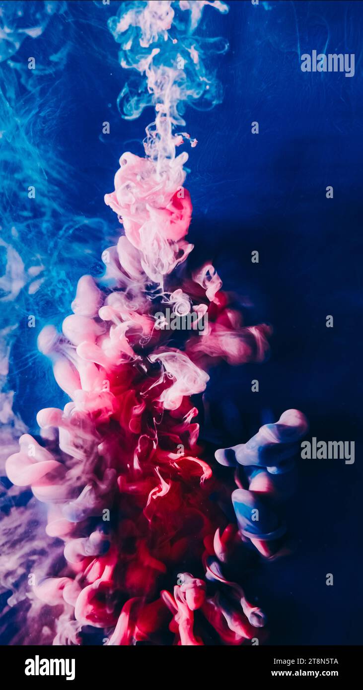 Color vapor background pink paint mix blue water Stock Photo - Alamy
