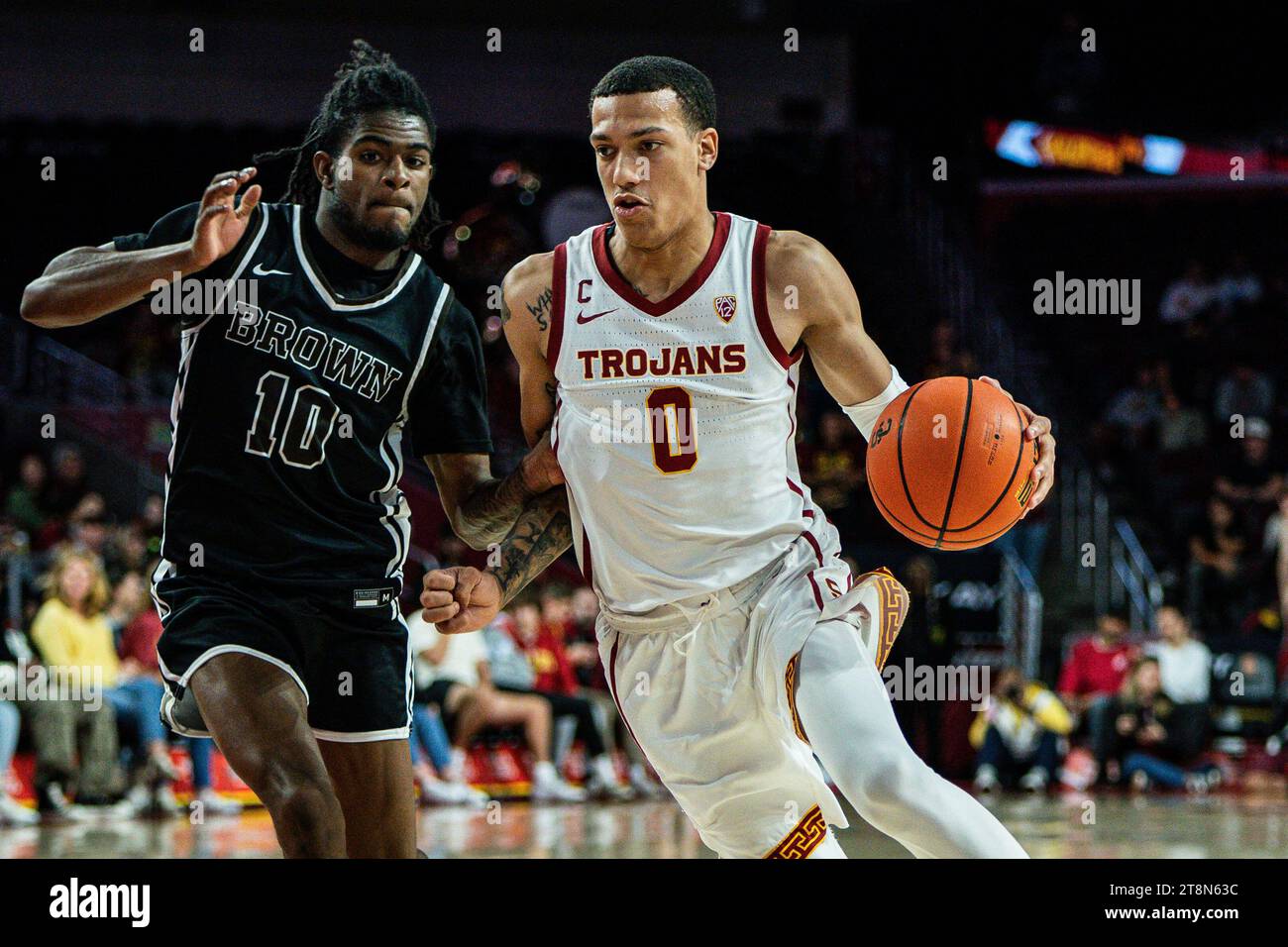 USC Trojans guard Kobe Johnson (0) is defended by Brown Bears guard ...