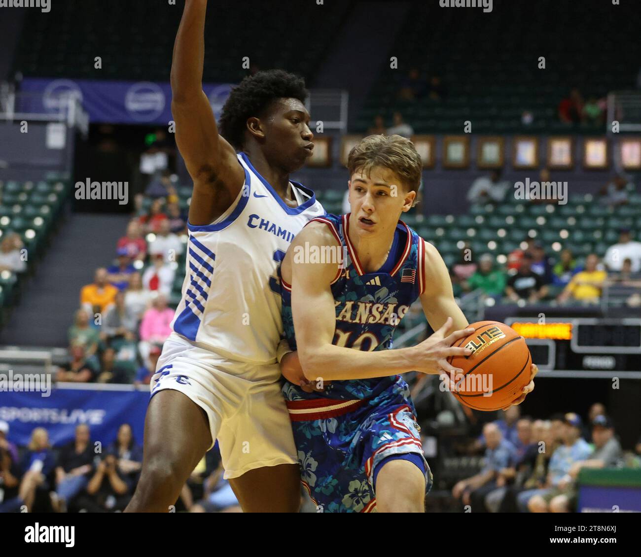 Kansas guard Johnny Furphy (10) tries to get past Chaminade forward ...