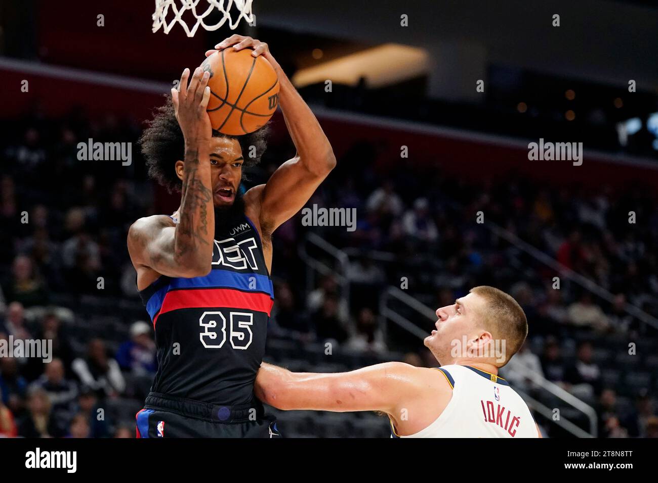 Detroit Pistons forward Marvin Bagley III (35) pulls down a rebound next to Denver Nuggets ...