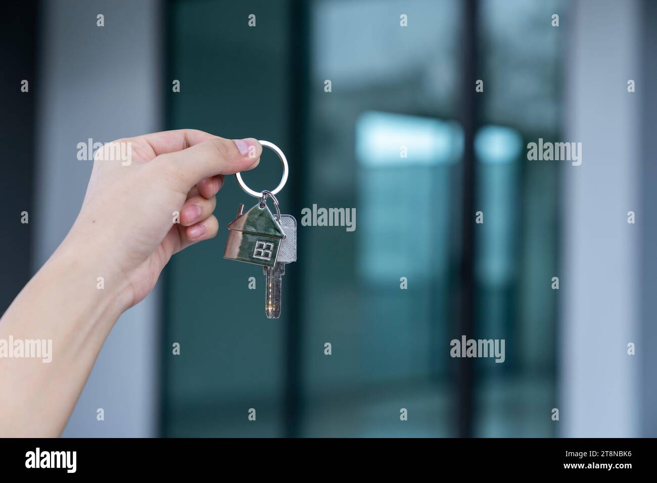 Female hand holding house hi-res stock photography and images - Alamy