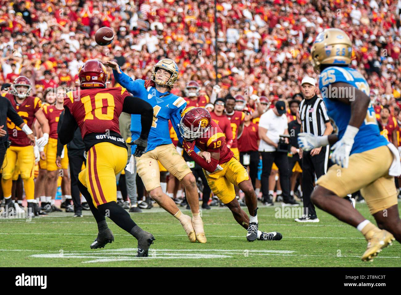 UCLA Bruins quarterback Ethan Garbers (4) evades USC Trojans safety ...