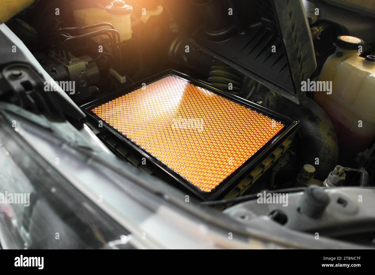 New car air filter on a filter compartment of air duct in car engine ...