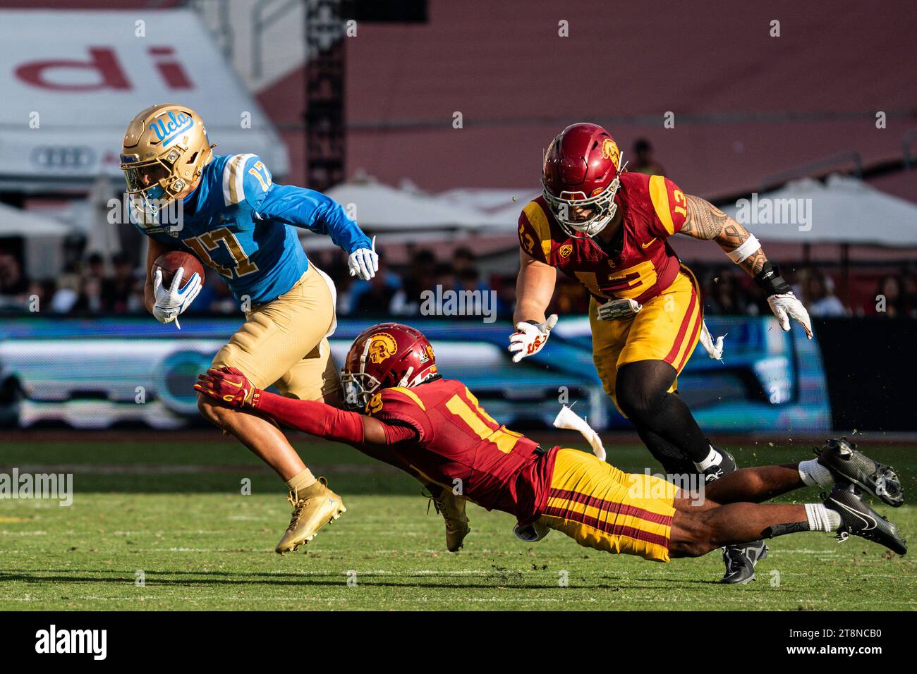 UCLA Bruins wide receiver Logan Loya (17) is defended by USC Trojans ...