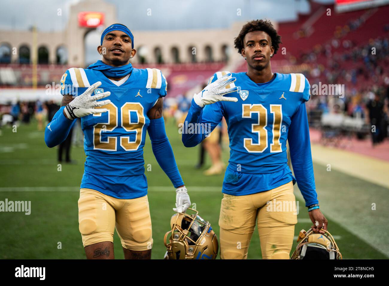 UCLA Bruins defensive back Evan Thomas (29) and UCLA Bruins defensive ...