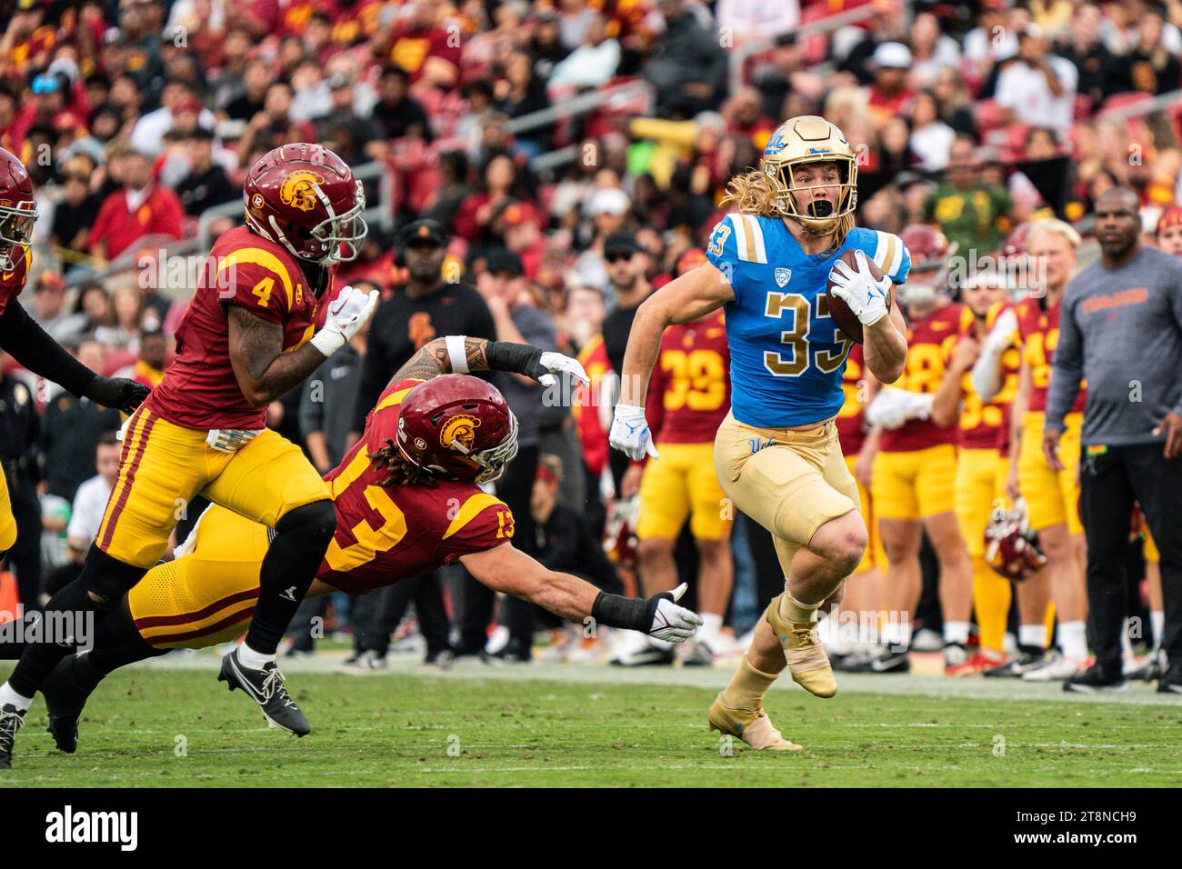 USC Trojans linebacker Mason Cobb (13) misses on a tackle against UCLA ...