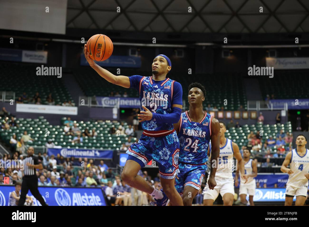 Kansas guard Dajuan Harris Jr. (3) makes a pass during an NCAA college ...