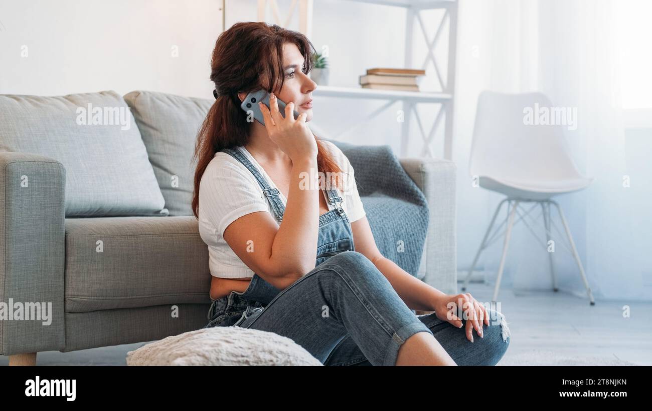 Mobile connection middle-aged woman home rest Stock Photo - Alamy