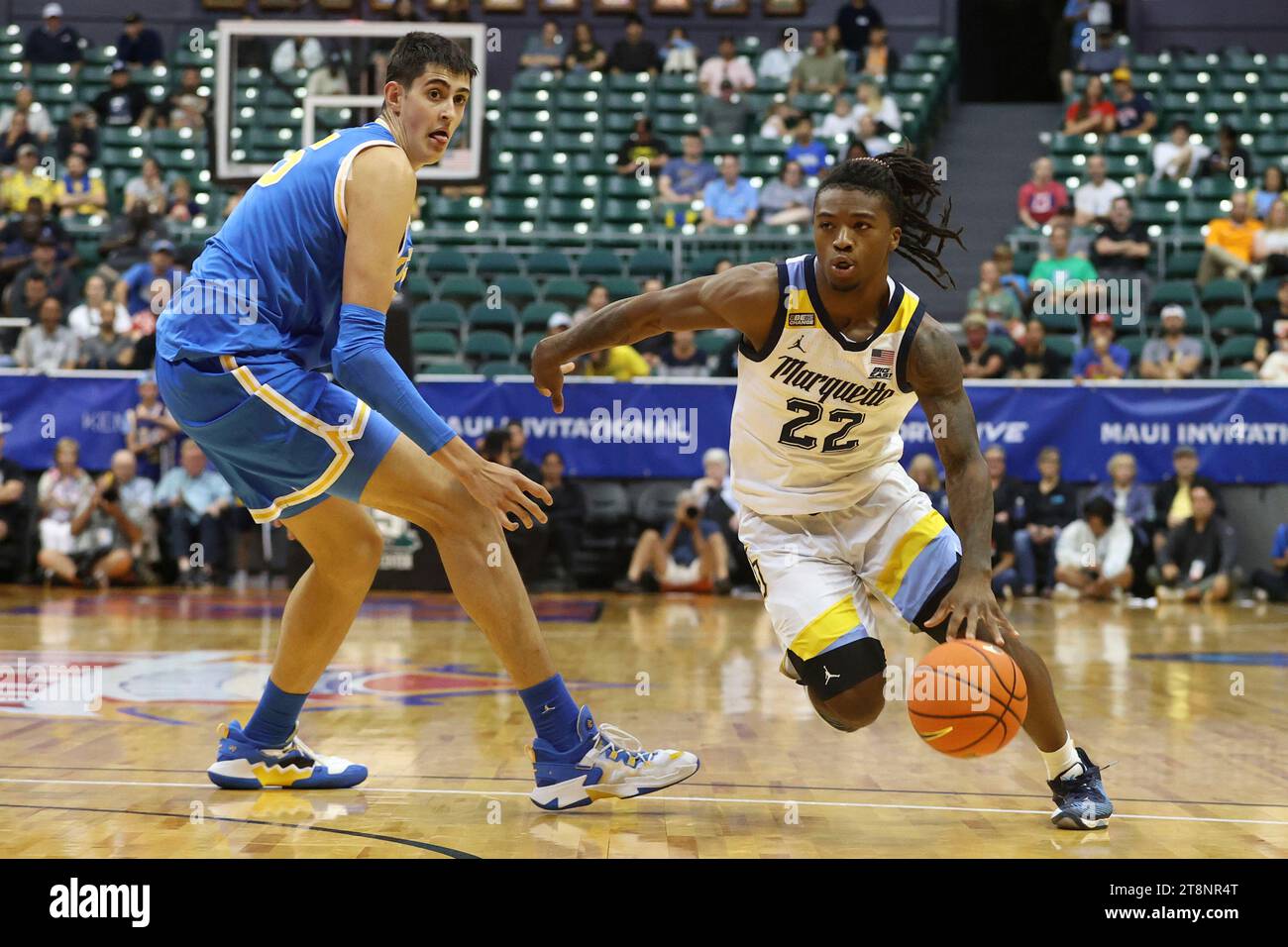 Marquette guard Sean Jones (22) gets past UCLA forward Berke ...