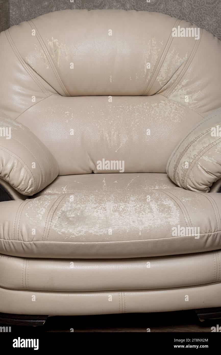 Defects on a white leather sofa. Damaged to leather furniture Stock ...