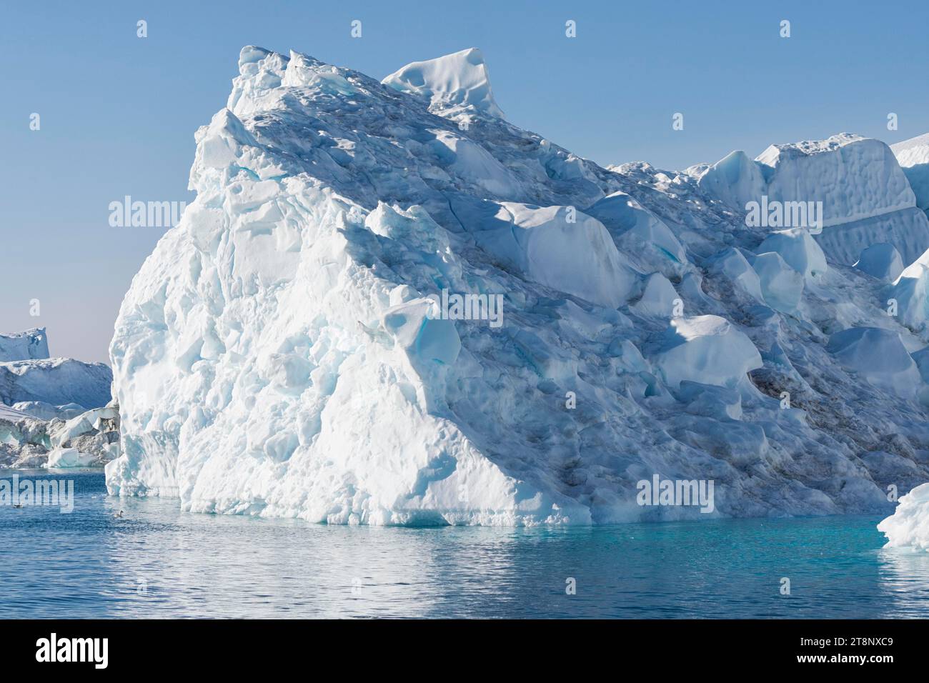 Huge iceberg in the UNESCO World Heritage Ilulissat Icefjord seen from ...